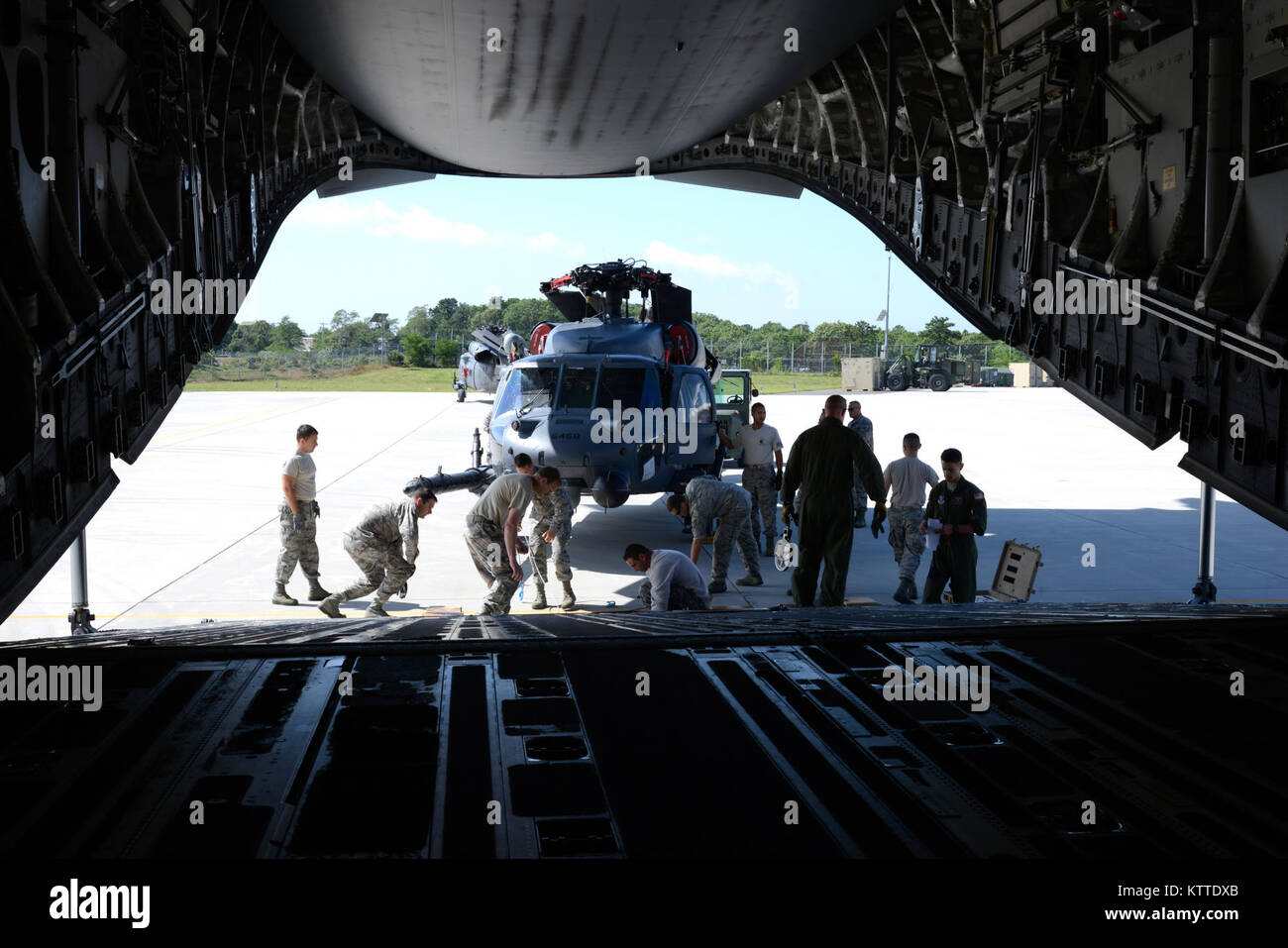 Airmen assigned to the 105th Airlift Wing and 106th Rescue Wing load ...