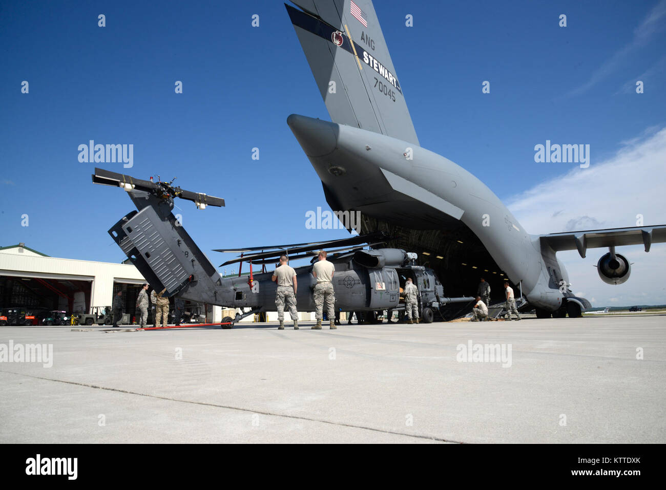 Airmen assigned to the 105th Airlift Wing and 106th Rescue Wing load ...