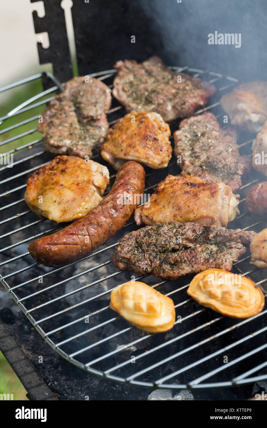 barbecue with delicious grilled meat on grill Stock Photo - Alamy