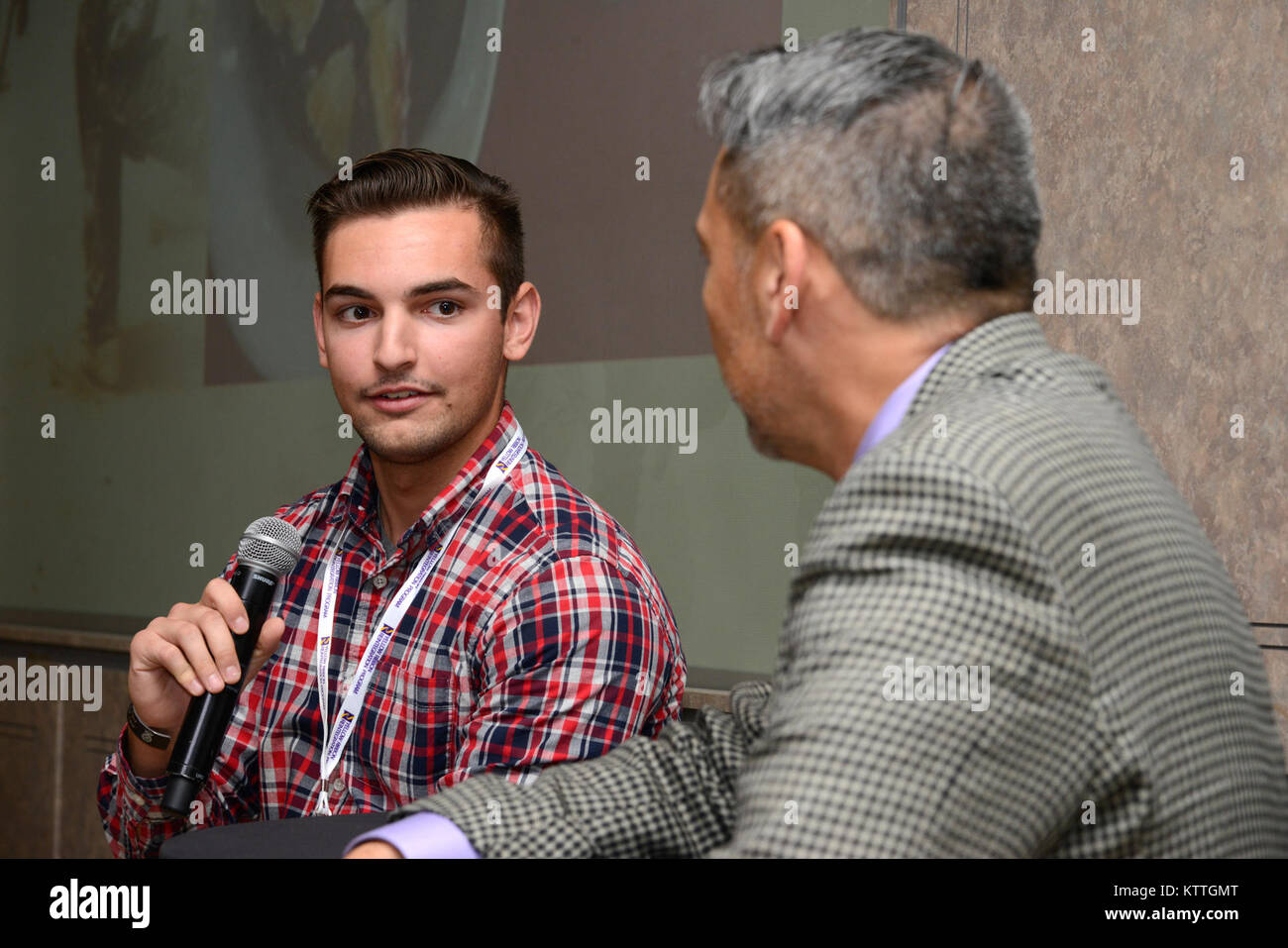 Senior Airman James Doyle and keynote speaker Erik Engel demonstrate ...
