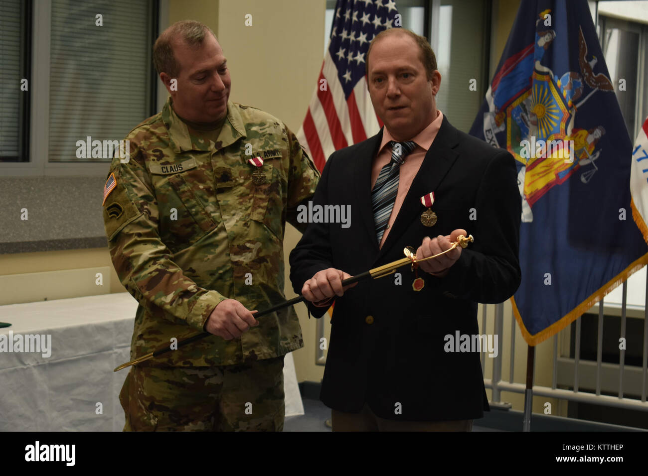 N.Y. Army National Guard Soldier, Lt. Col. Joseph Claus, presents his ...