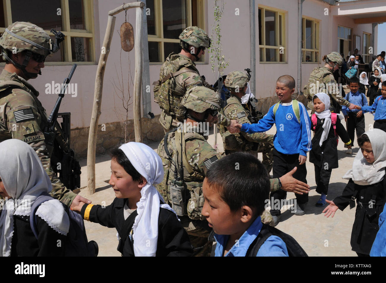 Soldiers of the 37th Infantry Brigade Combat Team shake hands with ...