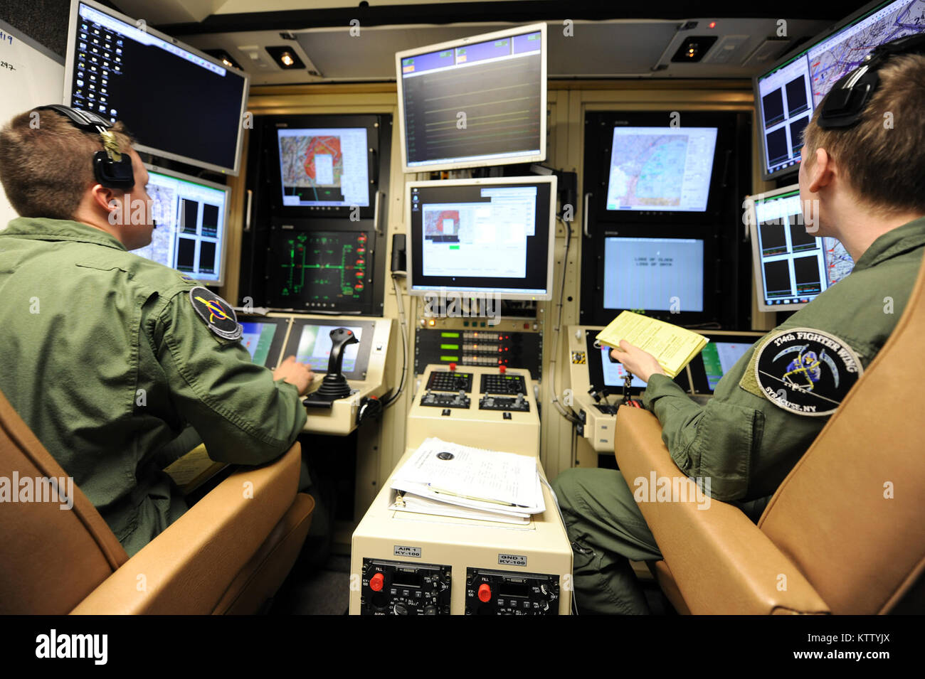 A student pilot and sensor operator man the controls of a MQ-9 Reaper ...