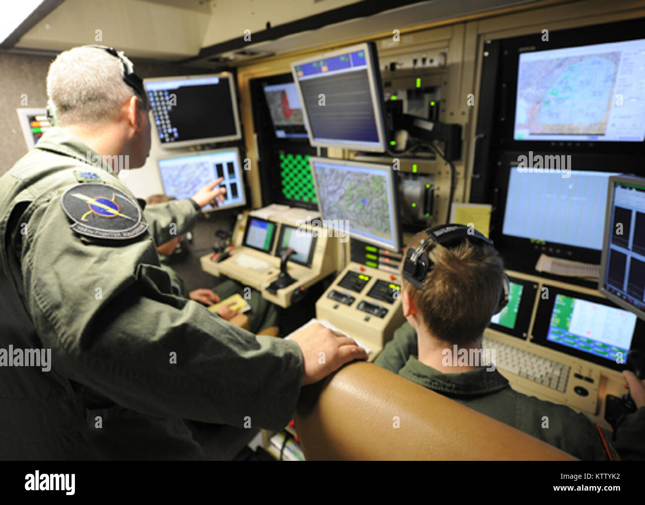 A student pilot and sensor operator man the controls of a MQ-9 Reaper ...