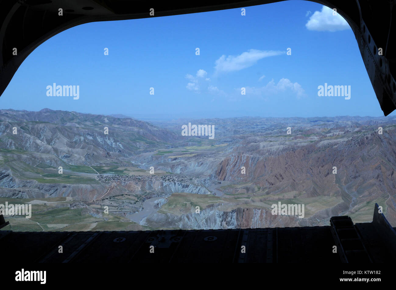The view from the ramp of a Chinook as it flies over the mountains ...