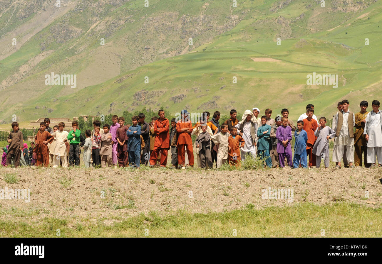 Afghan villagers gather near Khwahan, Badakhshan Province, Afghanistan ...