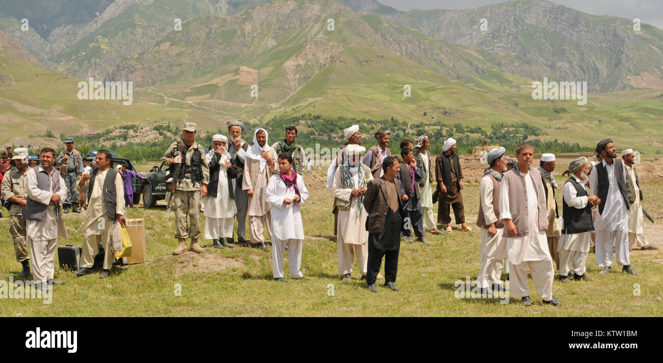 Afghan villagers gather near Khwahan, Badakhshan Province, Afghanistan ...