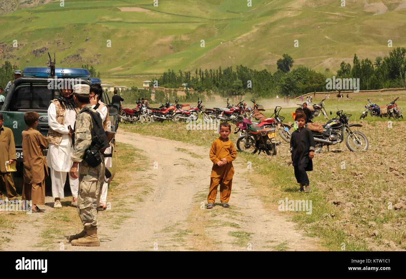 Afghan villagers gather near Khwahan, Badakhshan Province, Afghanistan ...