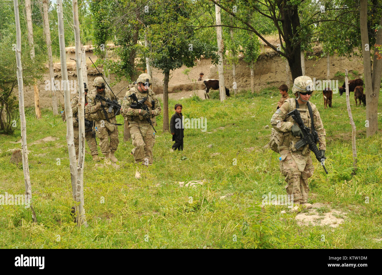 Soldiers of the 37th Infantry Brigade Combat Team cross a meadow on ...