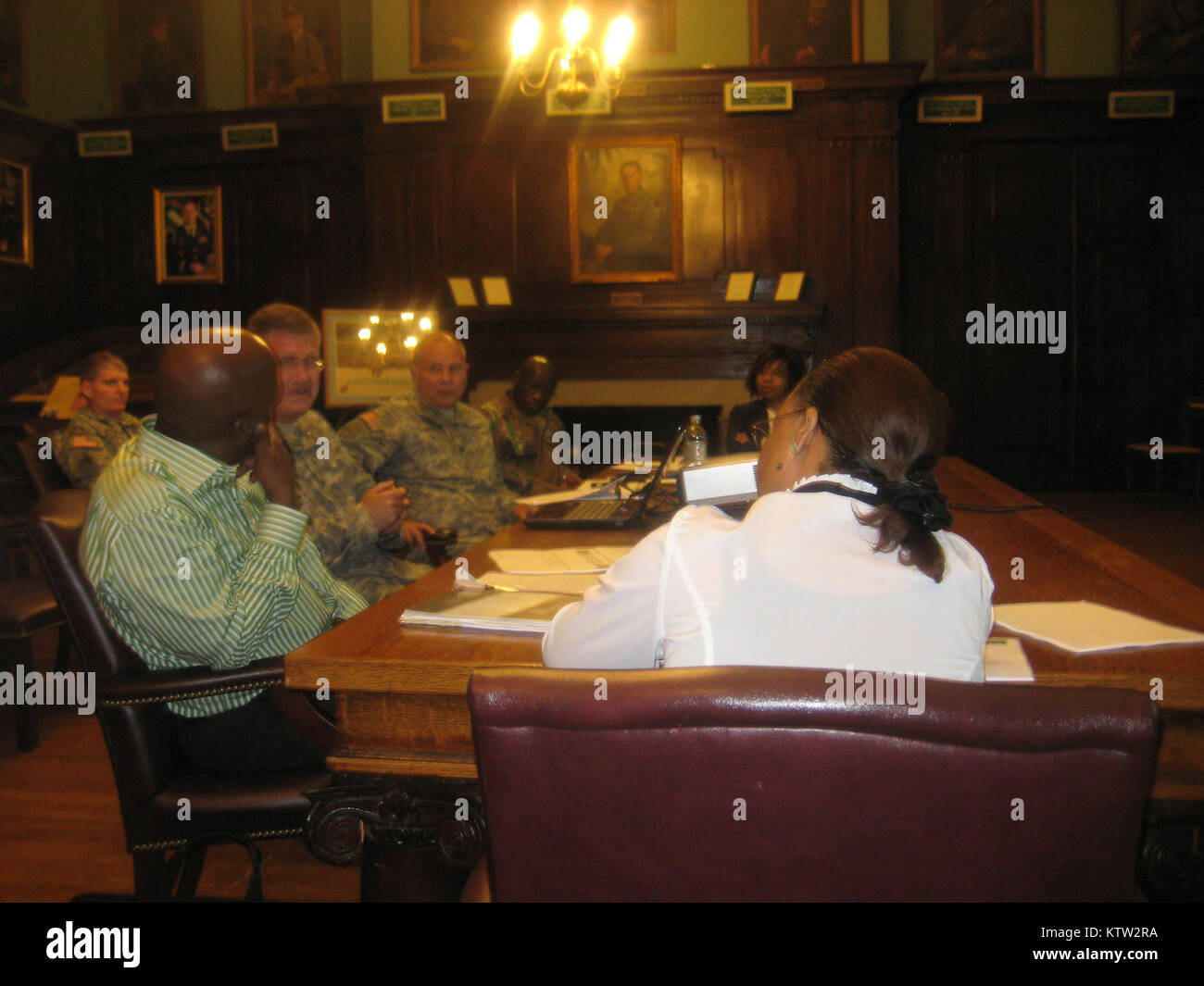 Members of the South AFrican Defence Force logistics team listen and ...