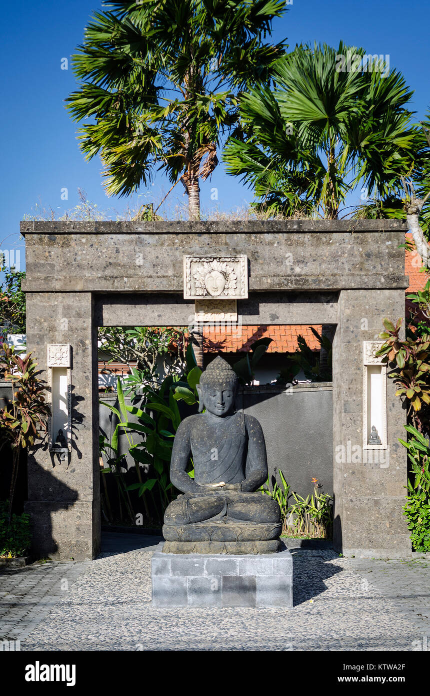 traditional balinese stone buddha statue and doorway in bali indonesia ...