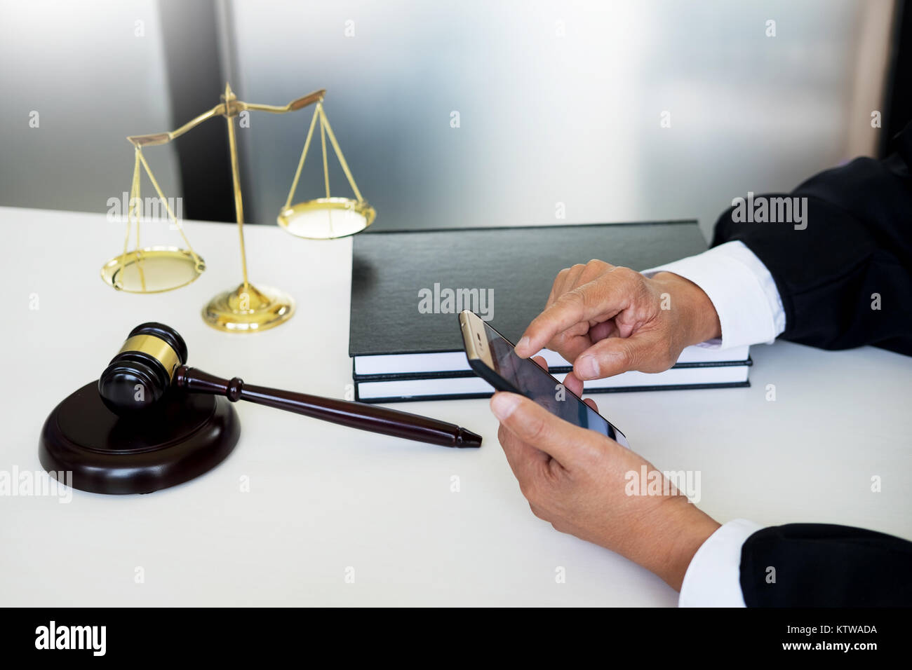lawyer hand using smart phone in court (justice, law) with sounding ...