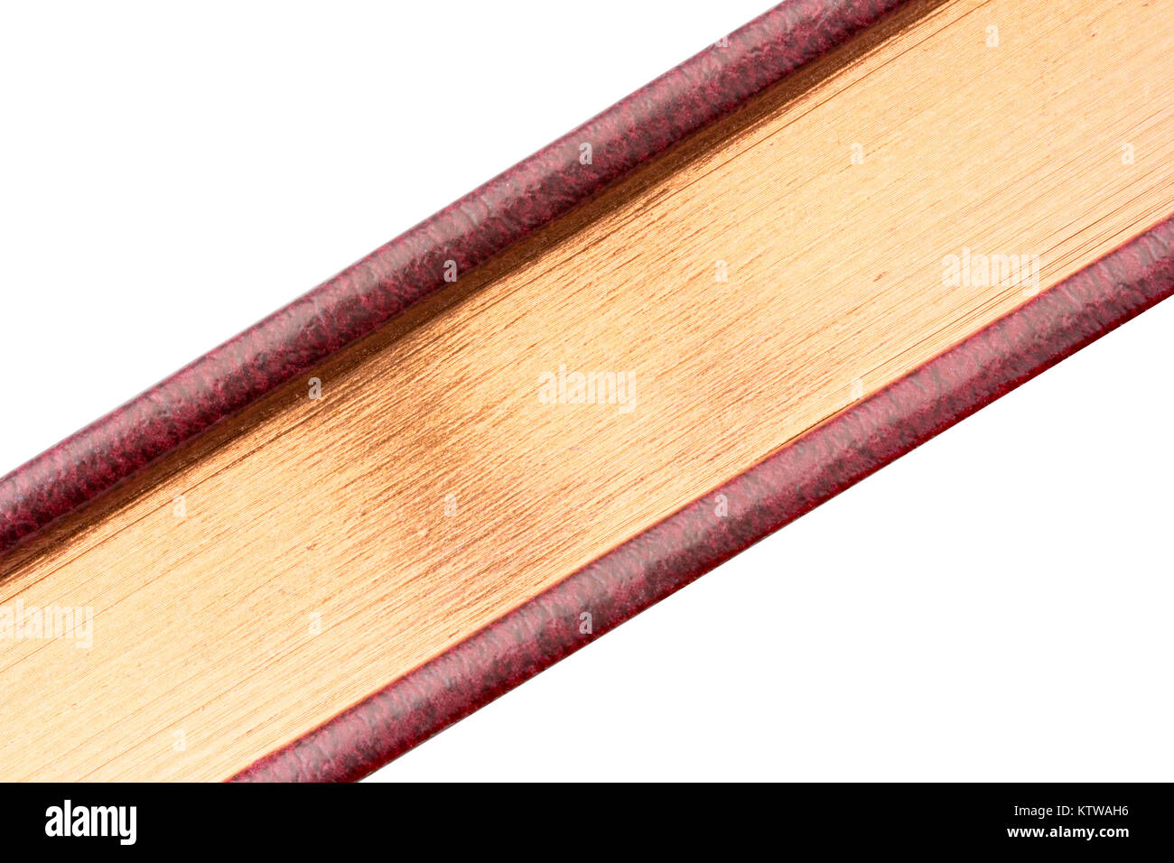 gilded edge of the book close-up on a diagonal isolated on white ...