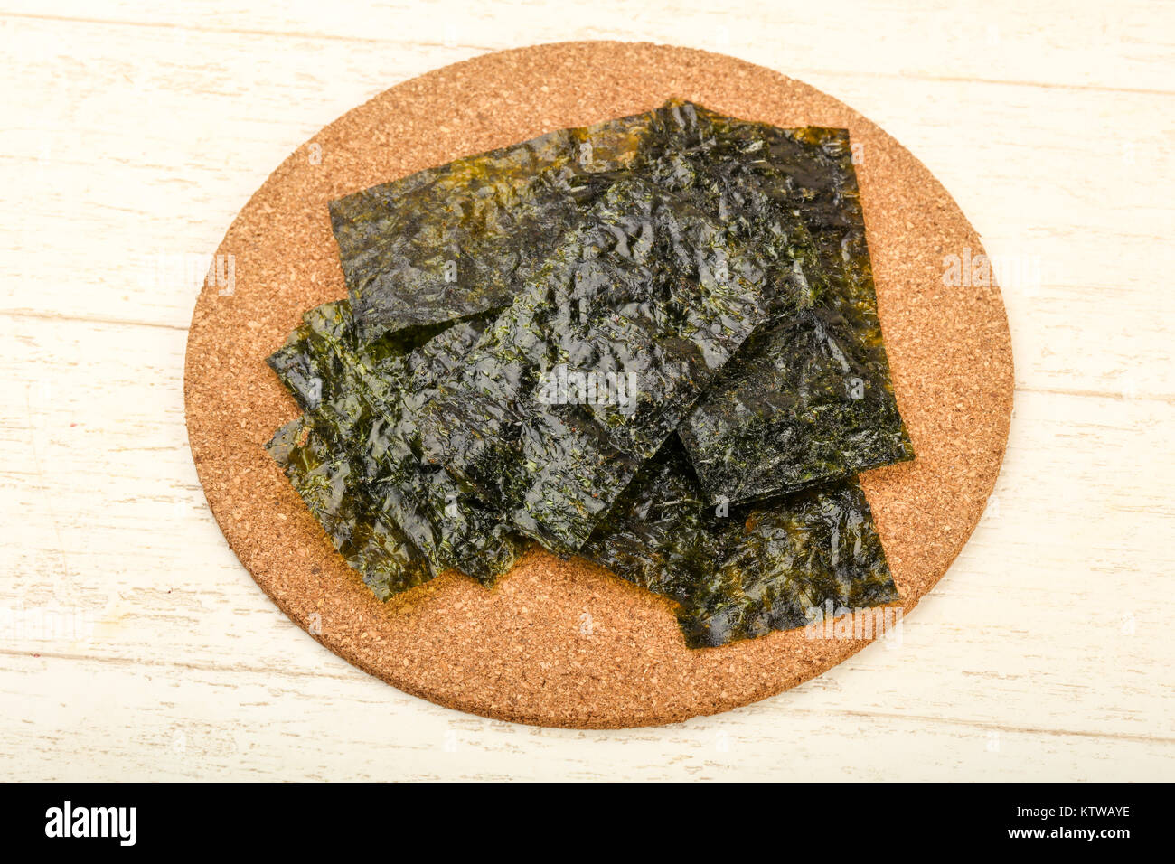 Crispy Nori sheets chips over wooden background Stock Photo - Alamy