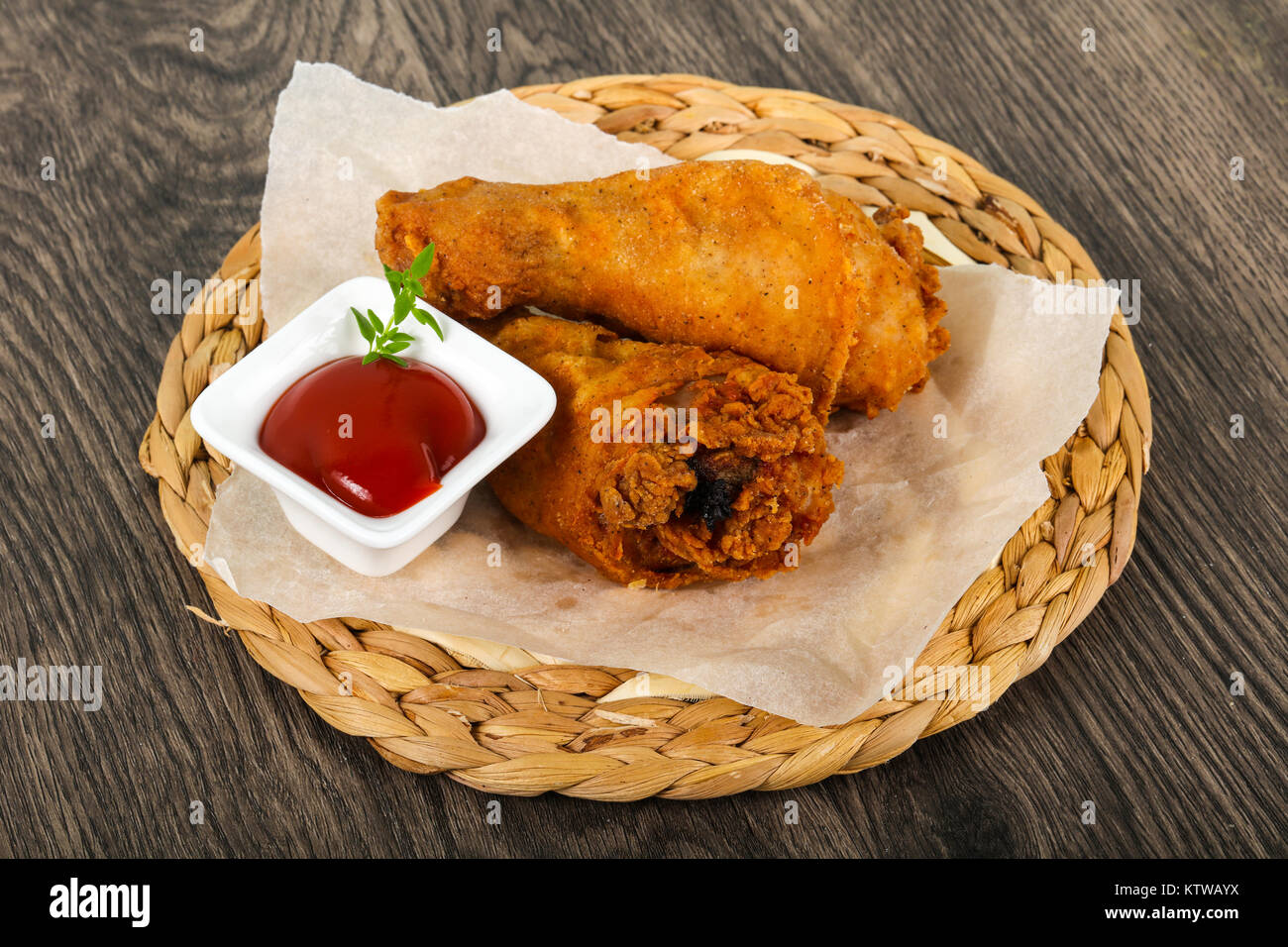 Crispy chicken legs with ketchup Stock Photo - Alamy