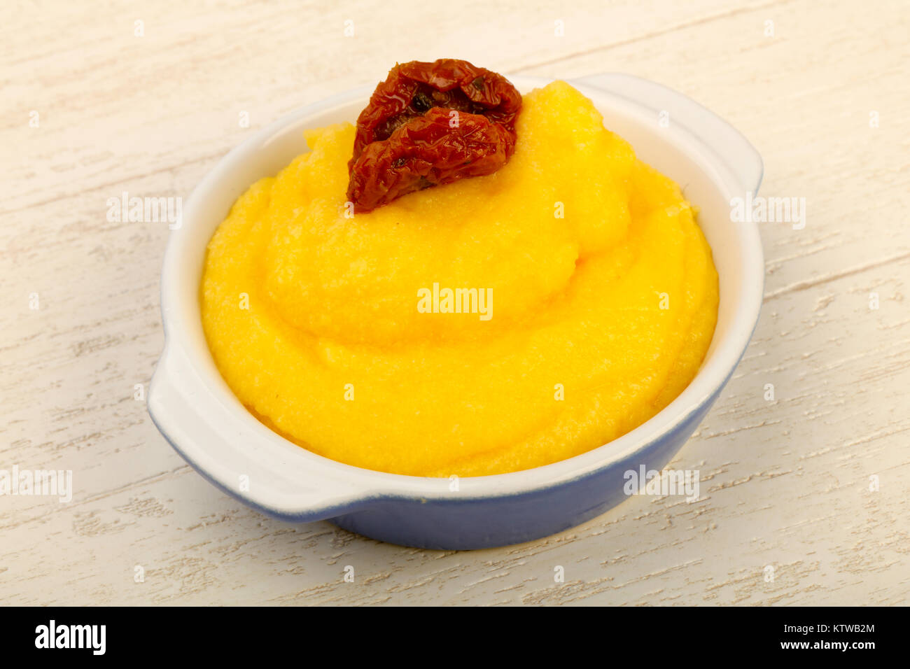 Polenta with dry tomato Stock Photo - Alamy