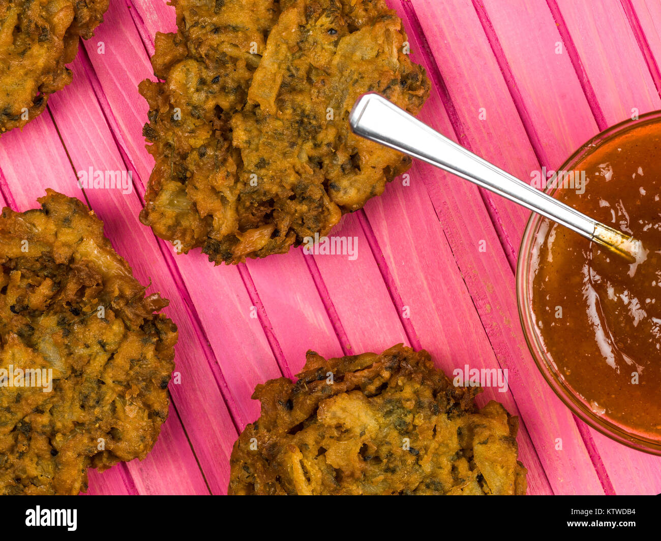 Onion Bhajis With Mango Chutney Against a Pink Background Stock Photo ...
