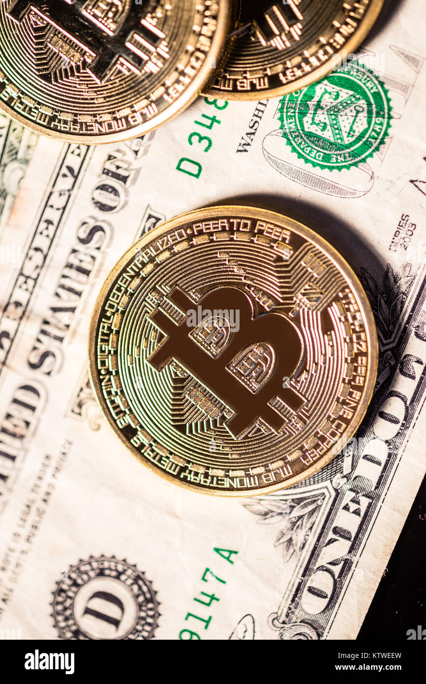 Bitcoins on outdated obsolete dollar bills, old vs new Stock Photo - Alamy