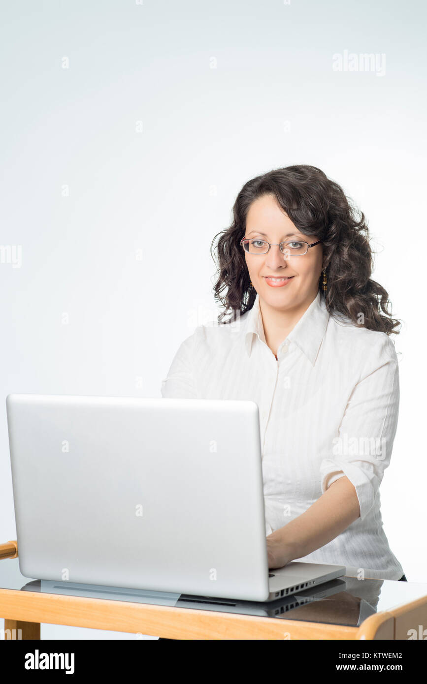 Color Photography of a young woman writing in a laptop Stock Photo - Alamy