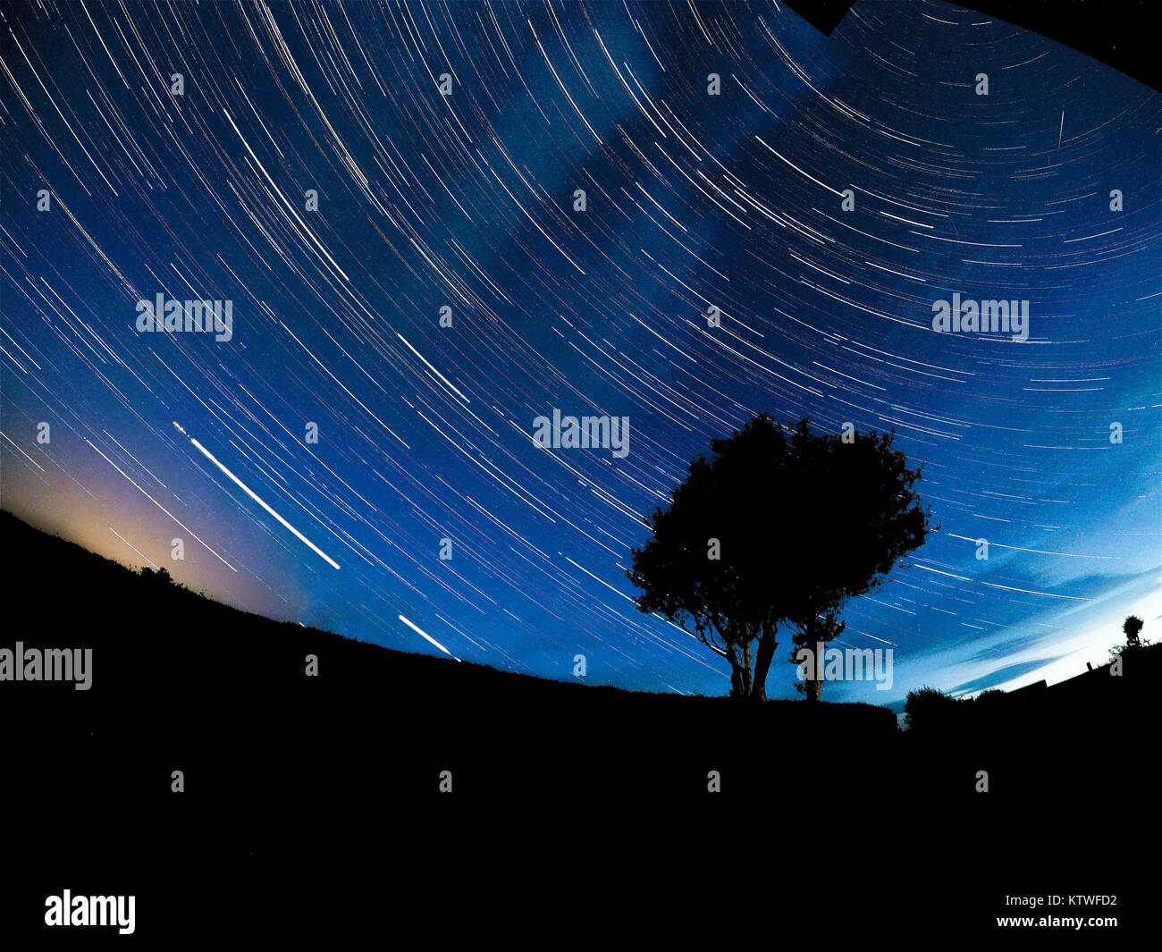 Star tails over the period of 8 hours time lapse Stock Photo - Alamy