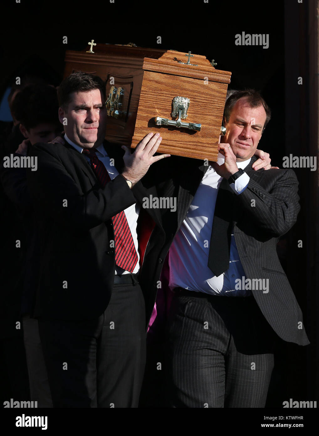 The coffin of former public servant Dr Maurice Hayes is carried from St ...