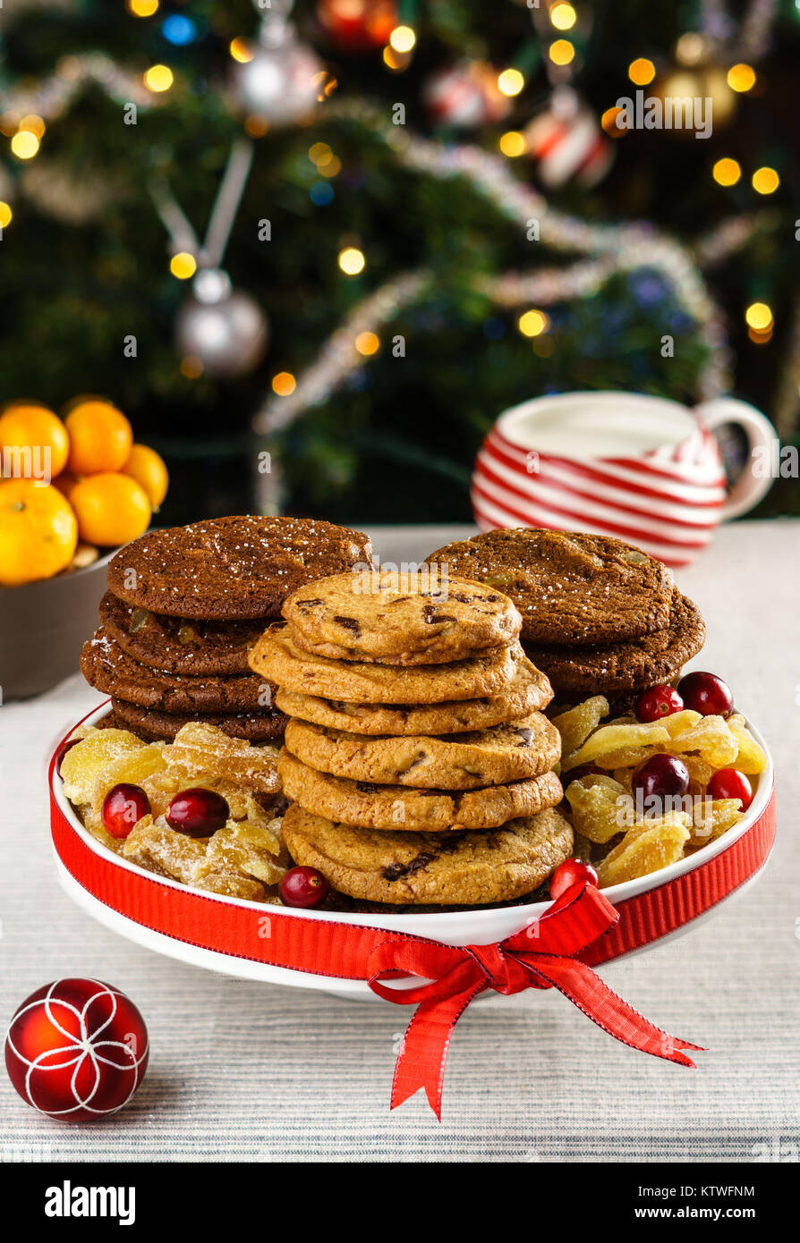 freshly baked chocolate chip cookies on a table with blurred background ...
