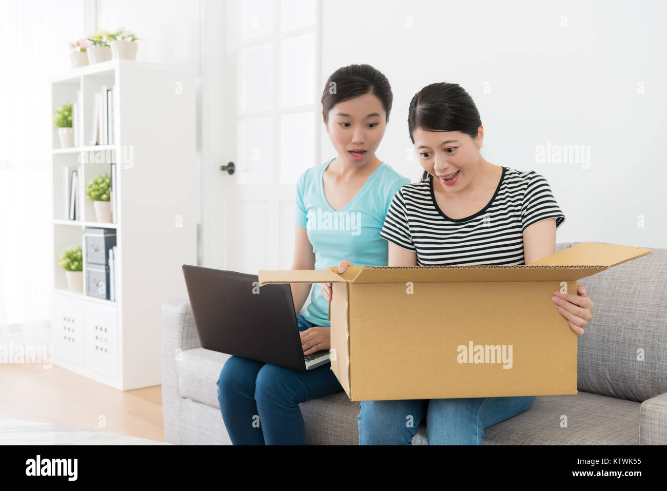 surprised pretty women received shipping parcel and opening finding ...