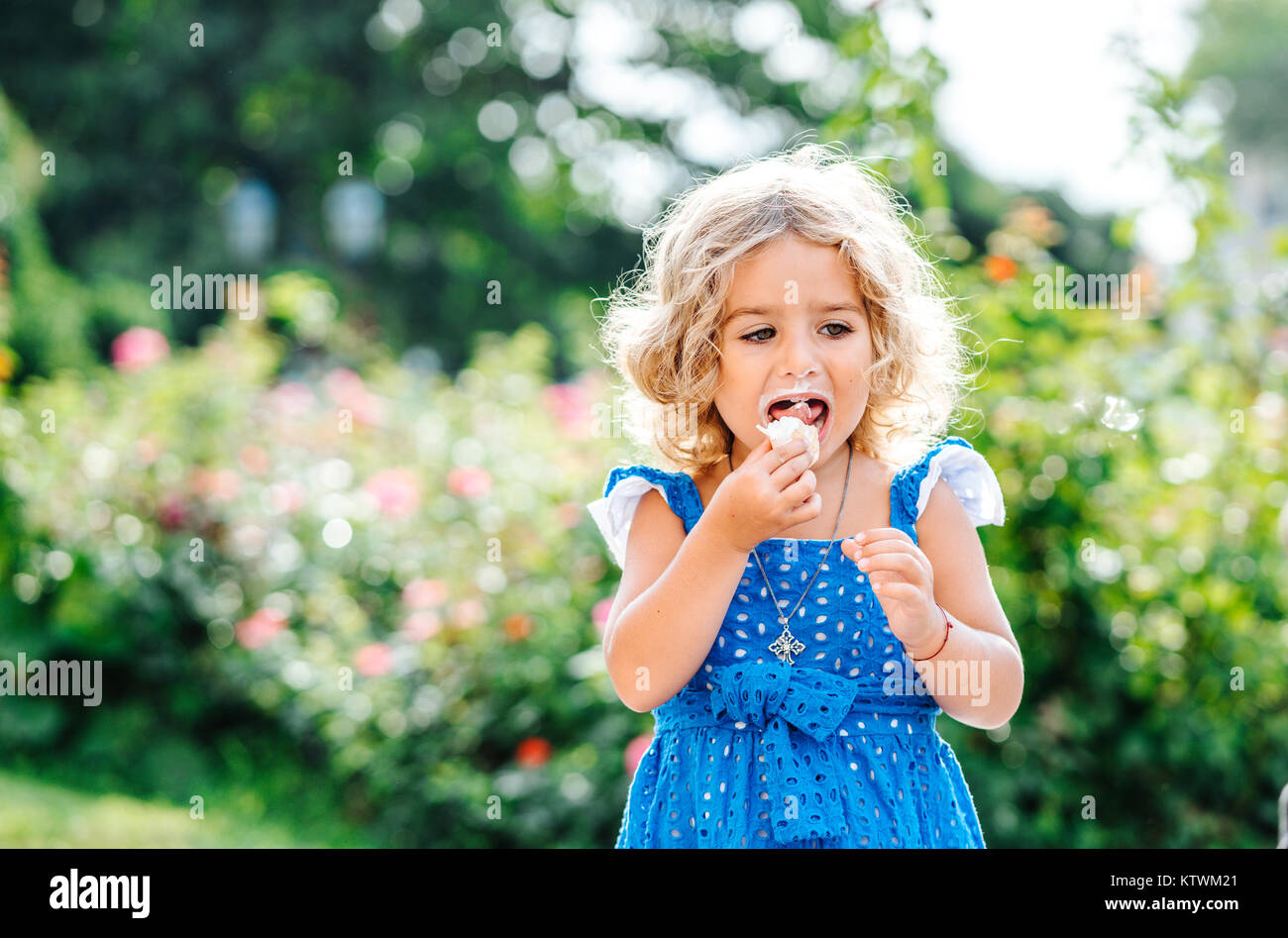 little girl eating ice cream Stock Photo - Alamy