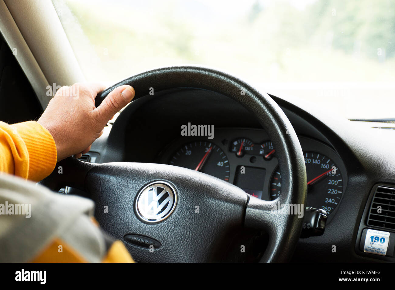 German old man driving car very fast on highway of Stuttgart go to ...