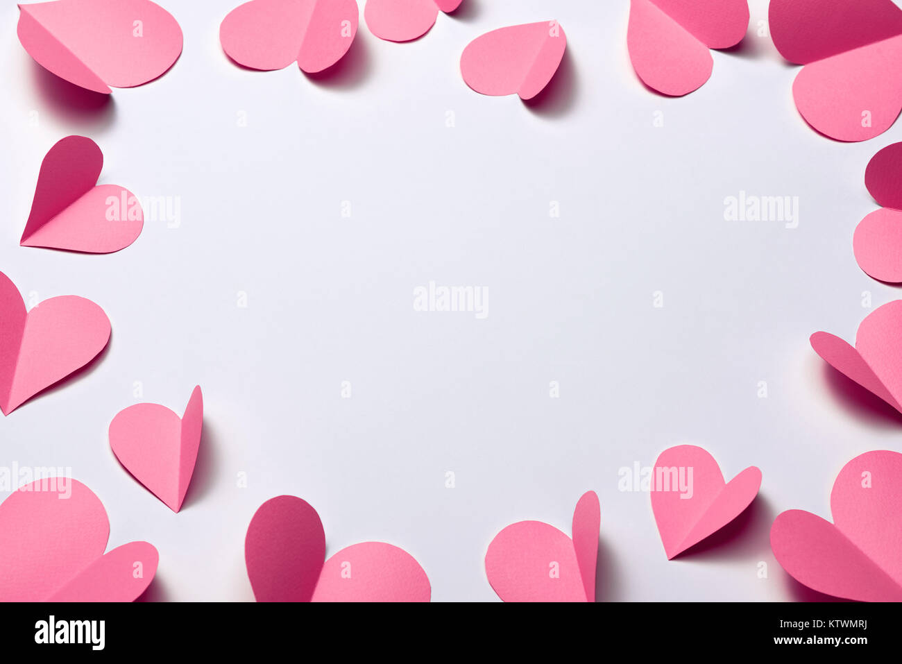 Beautiful pink paper hearts on white paper background Stock Photo - Alamy