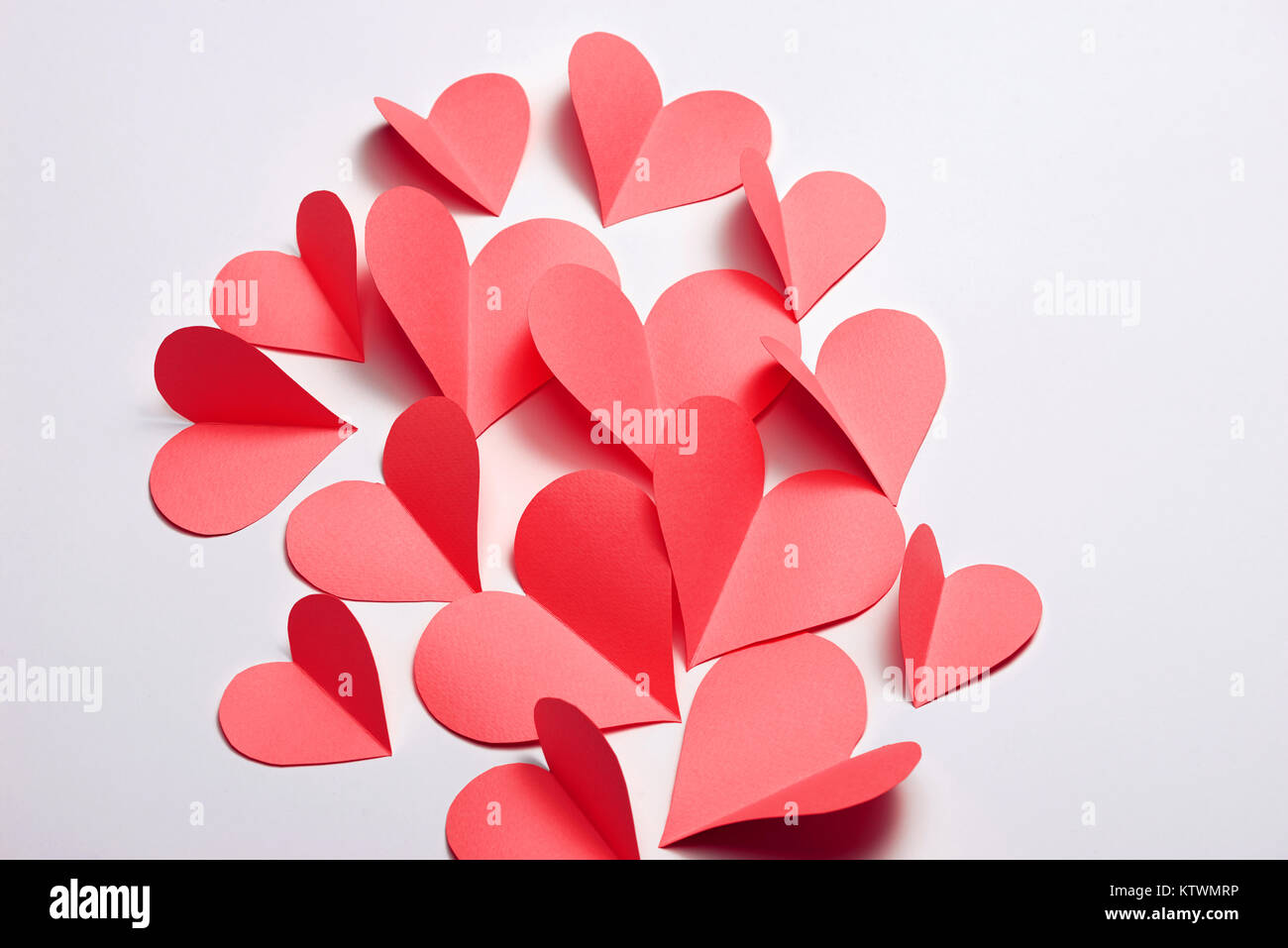 Beautiful pink paper hearts on white paper background Stock Photo - Alamy