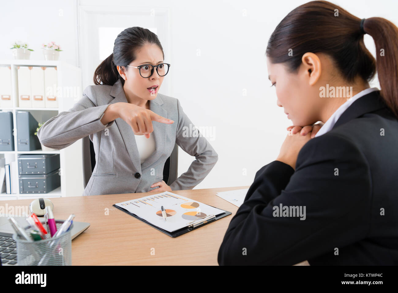 angry young female business manager pointing blame her employee sales ...