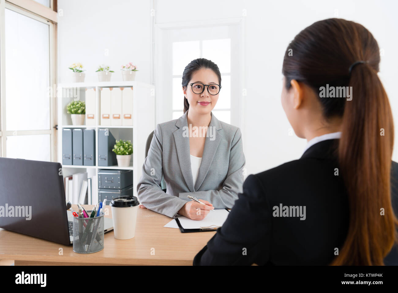 back view of young pretty girl joining company interview looking for ...