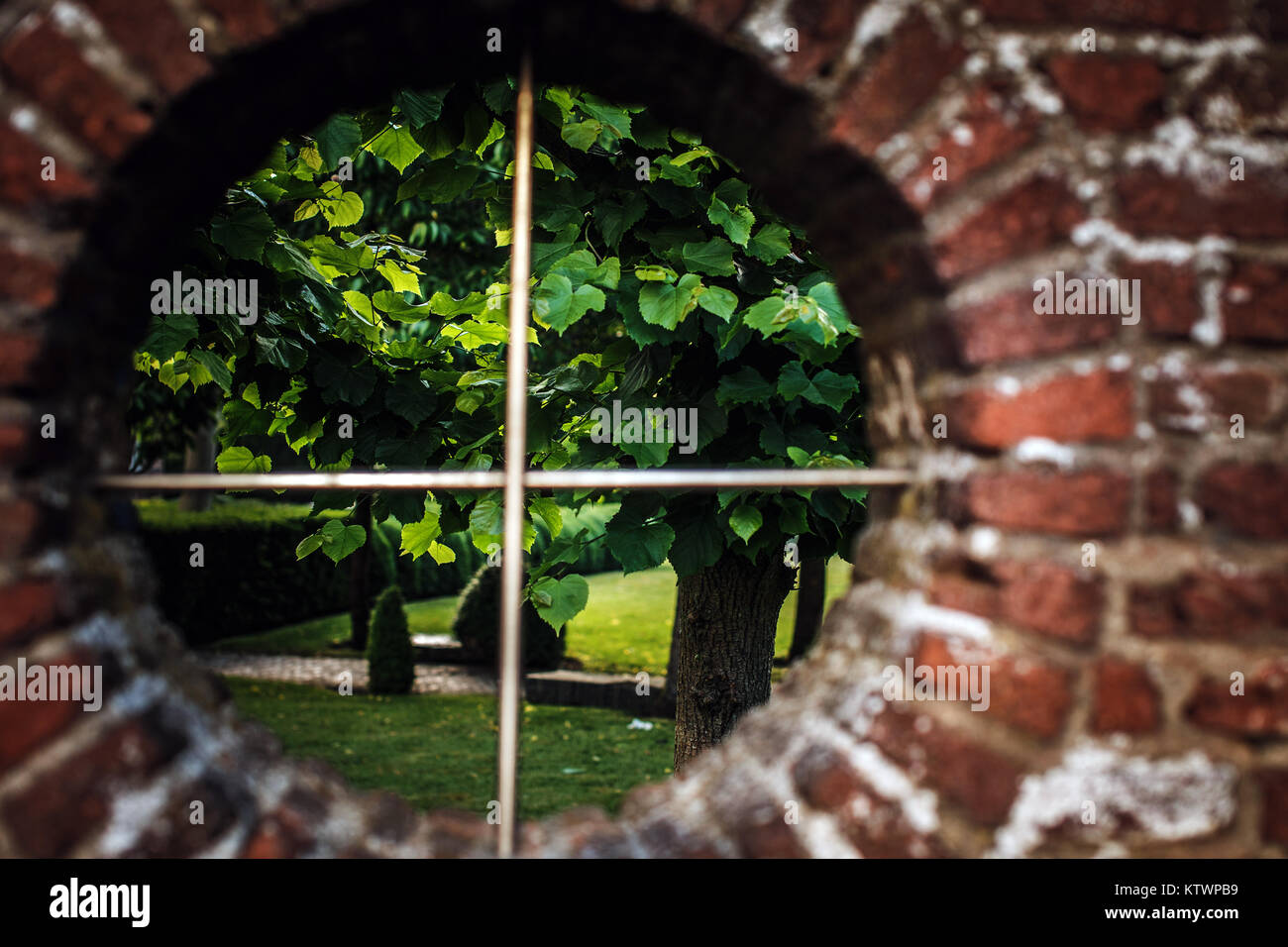 Landscape through round window Stock Photo - Alamy