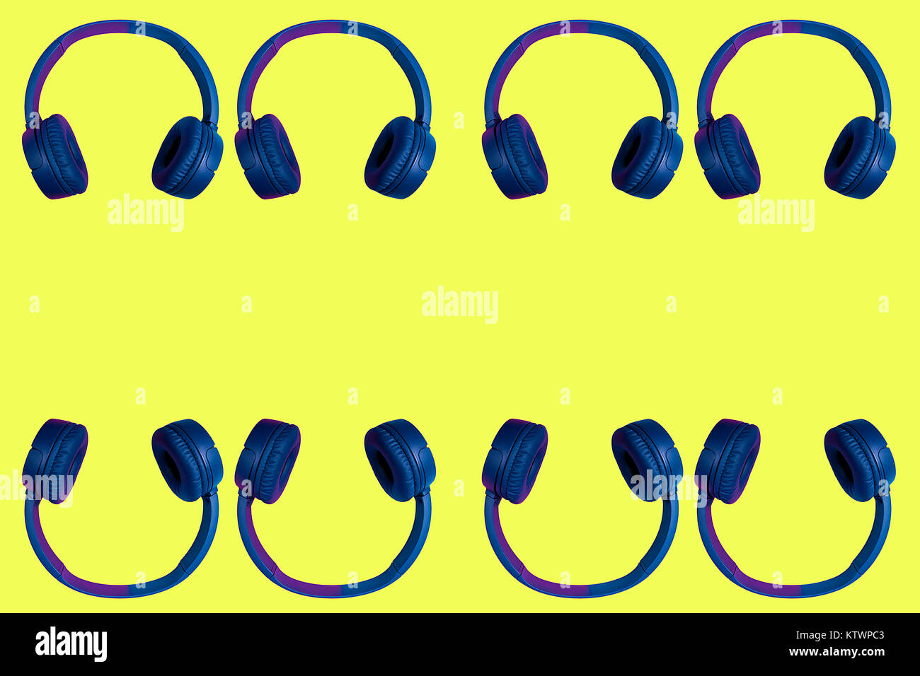 Multiple doubled wireless headphones on yellow background Stock Photo ...