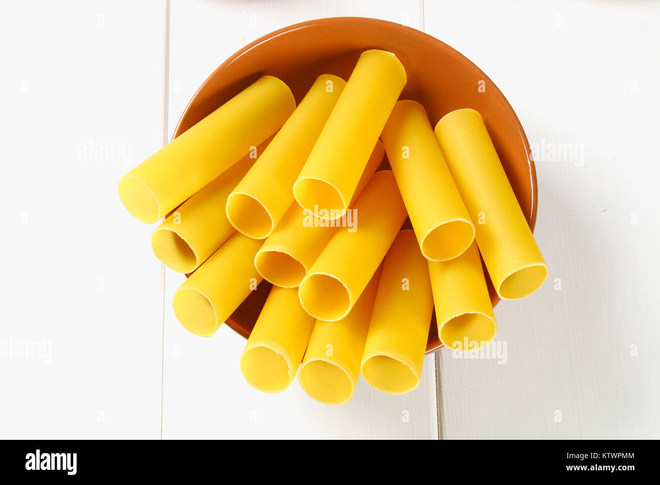 Italian pasta cannelloni. Raw tube for stuffing stuffing surrounded by ...