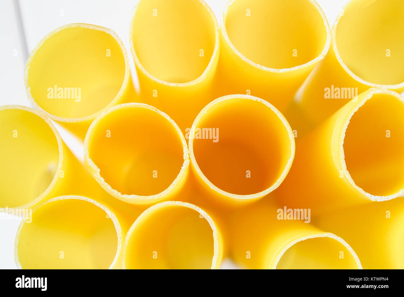 Italian pasta cannelloni. Raw tube for stuffing stuffing surrounded by ...