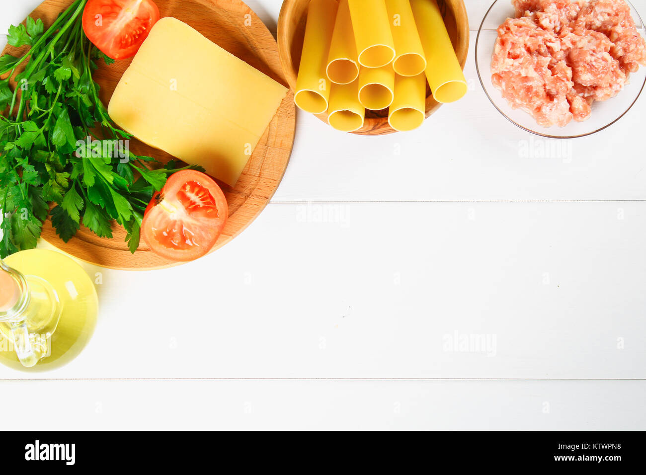 Italian pasta cannelloni. Raw tube for stuffing stuffing surrounded by ...