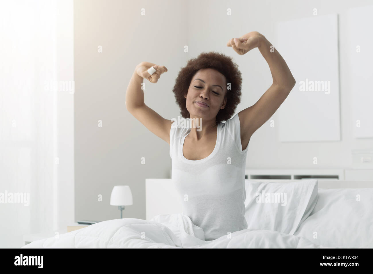 Black woman waking up in High Resolution Stock Photography and Images ...