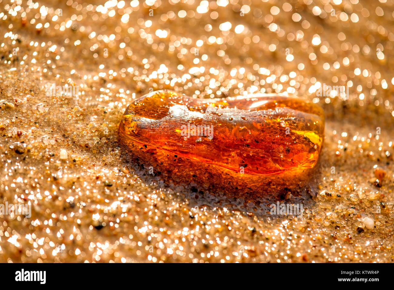 Amber on a beach of the Baltic Sea in the surf Stock Photo - Alamy