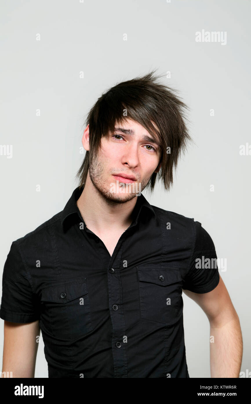 young man photo studio portrait, grey background Stock Photo - Alamy