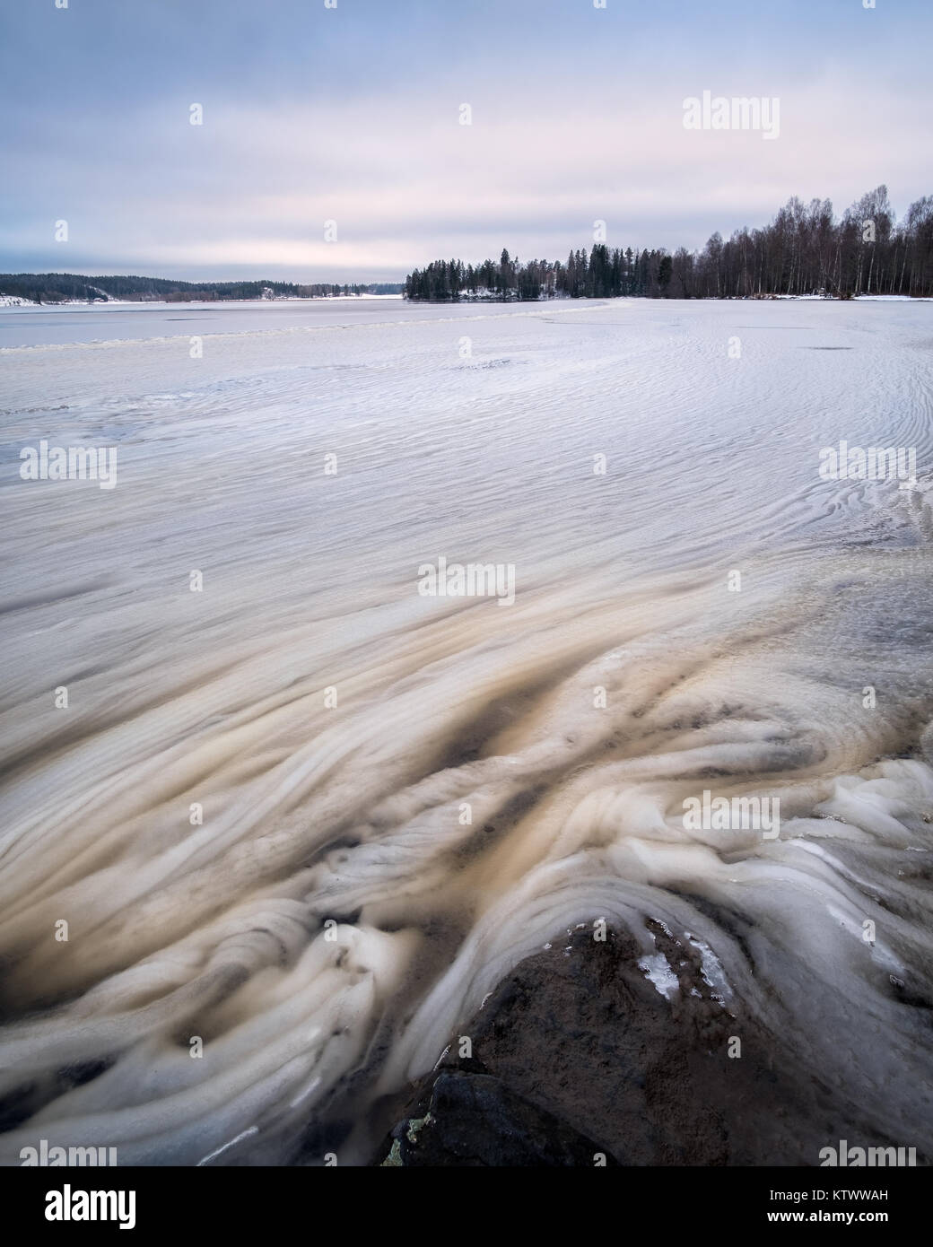 Ice shapes with melted lake at winter landscape in Finland Stock Photo ...
