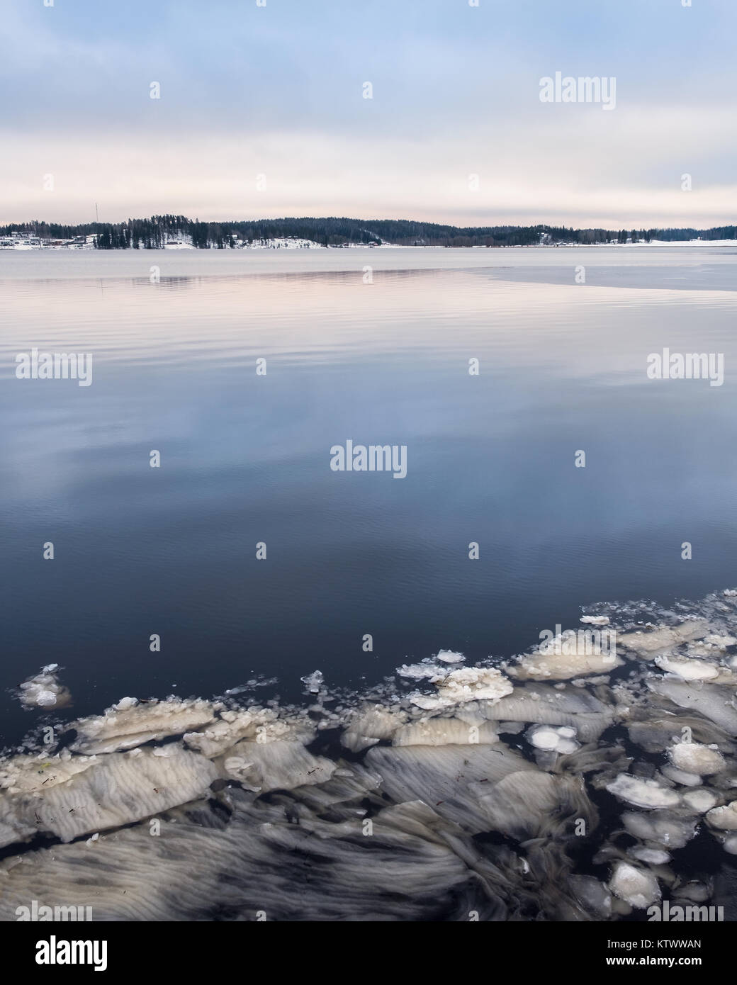 Ice shapes with melted lake at winter landscape in Finland Stock Photo ...