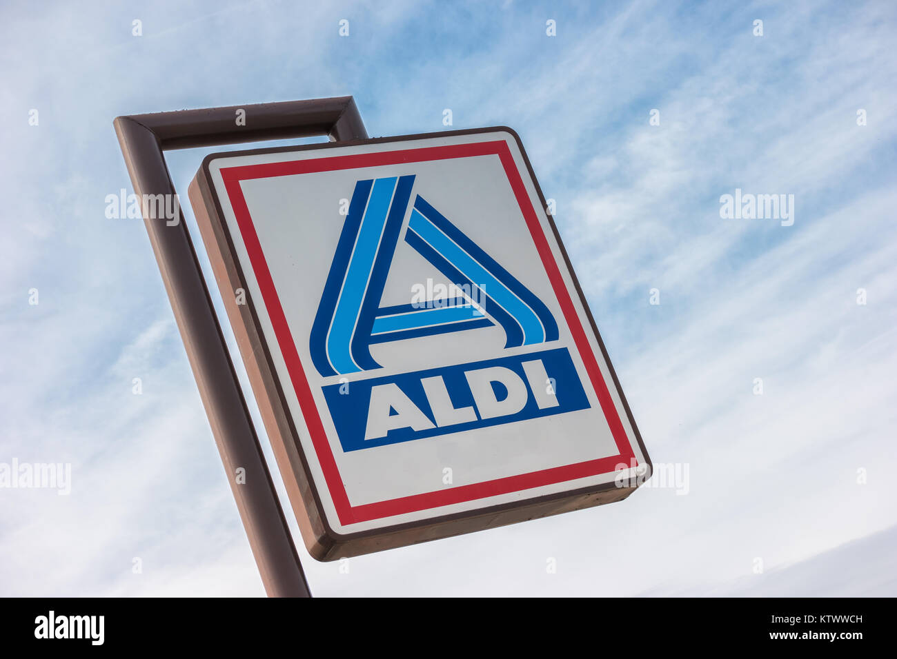 Aldi sign (north division) against blue sky. The German-based discount ...