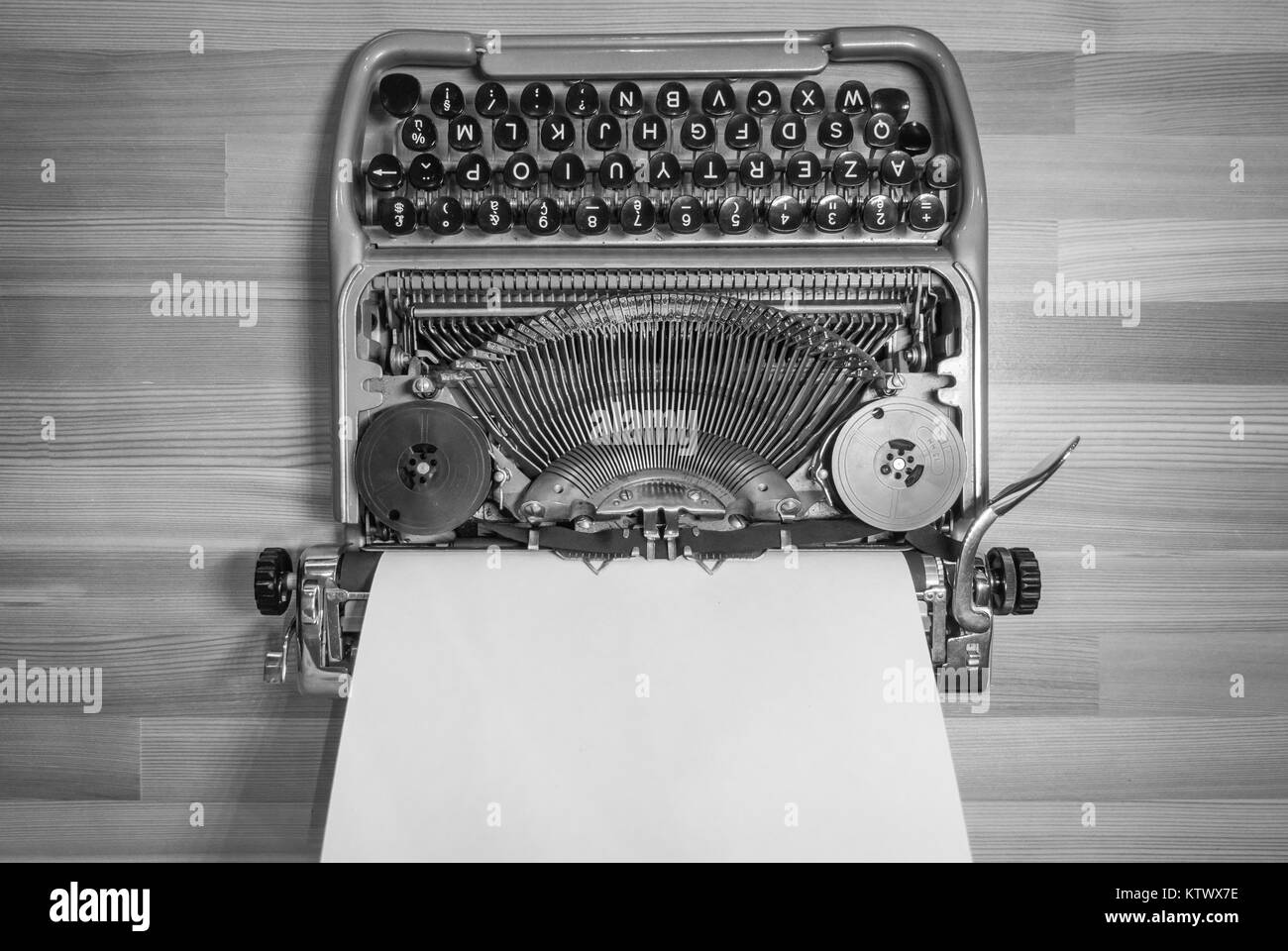 Typewriter ready for use with blank paper installed Stock Photo - Alamy