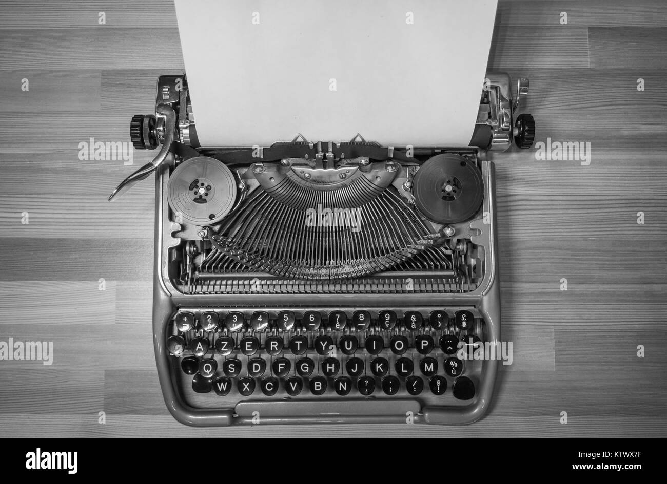 Typewriter ready for use with blank paper installed Stock Photo - Alamy