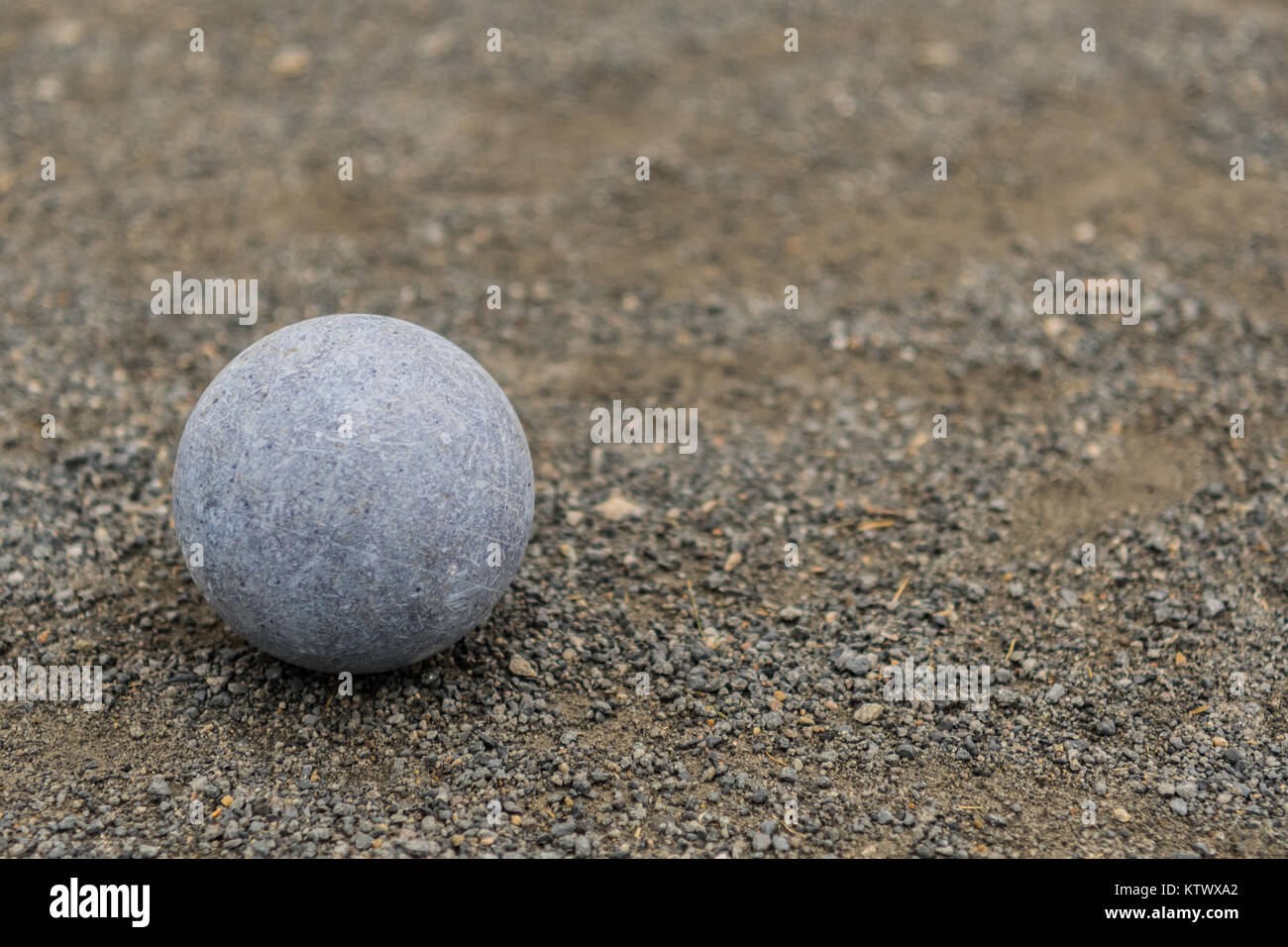 Blue Bocce Ball with Copy Space Right Over Gravel Surface Stock Photo ...