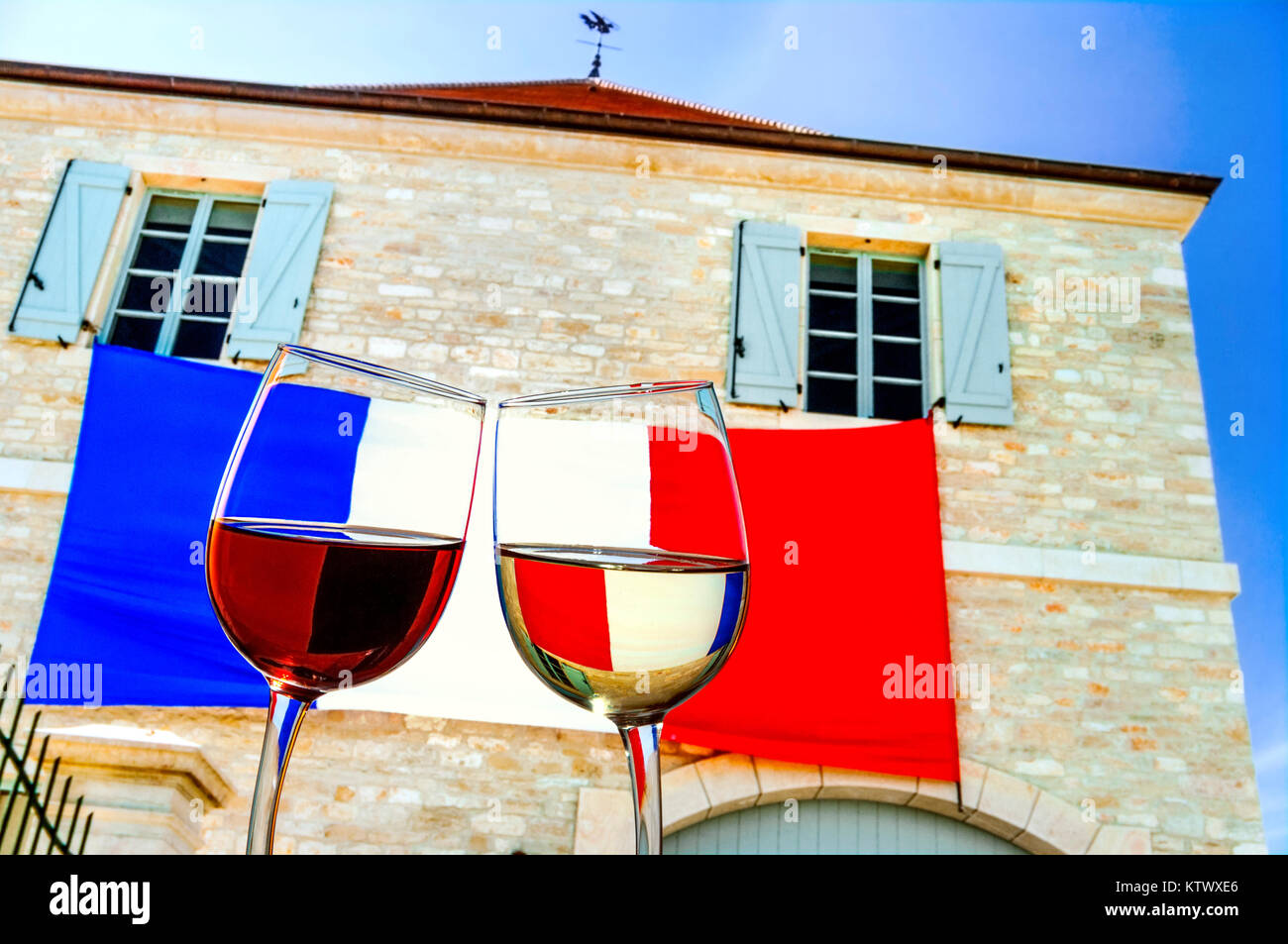 FRENCH WINE TASTING CHEERS Red and White wine glasses lean towards each ...
