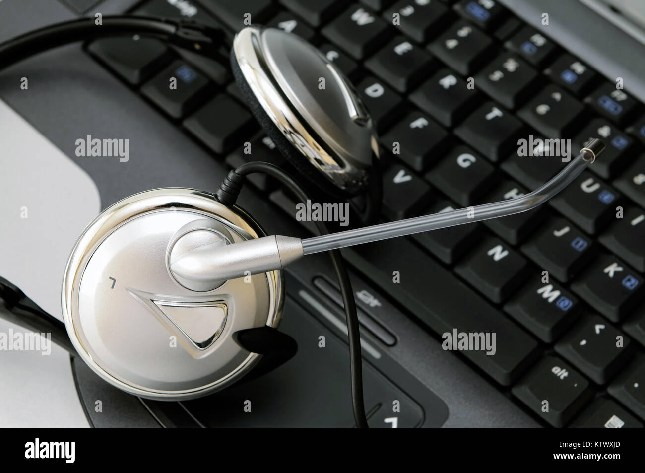 Laptop computer with headset close up shoot Stock Photo - Alamy