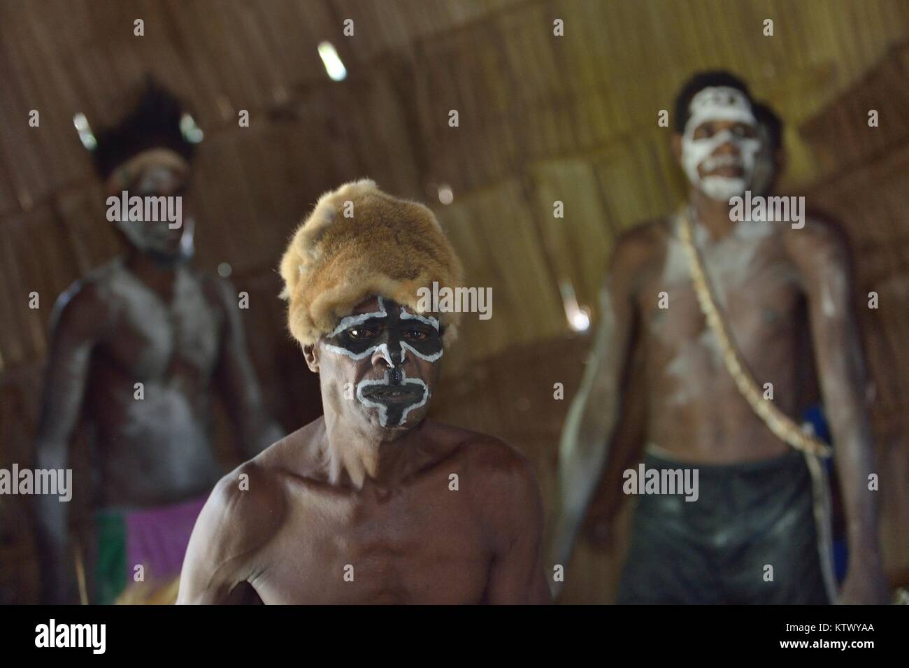 Portrait of a man from the tribe of Asmat people in the ritual face ...